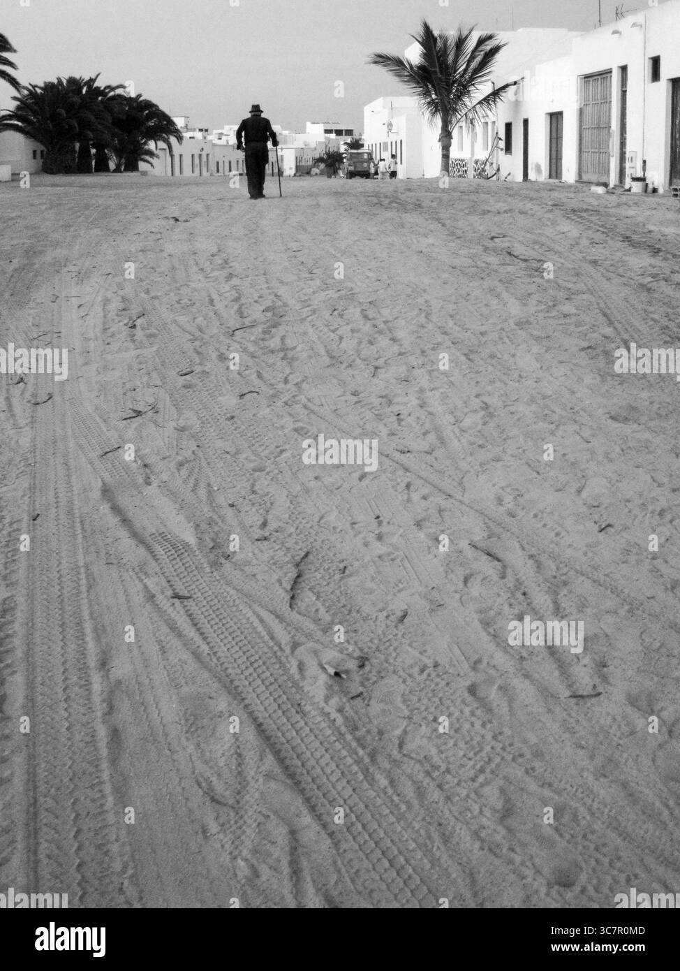 Man walking in local Black and White Stock Photos & Images - Alamy