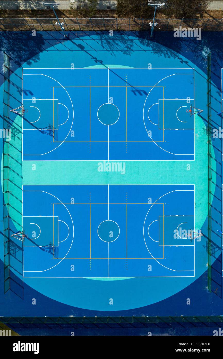 Aerial top view of vibrant blue basketball courts in urban outdoor ...