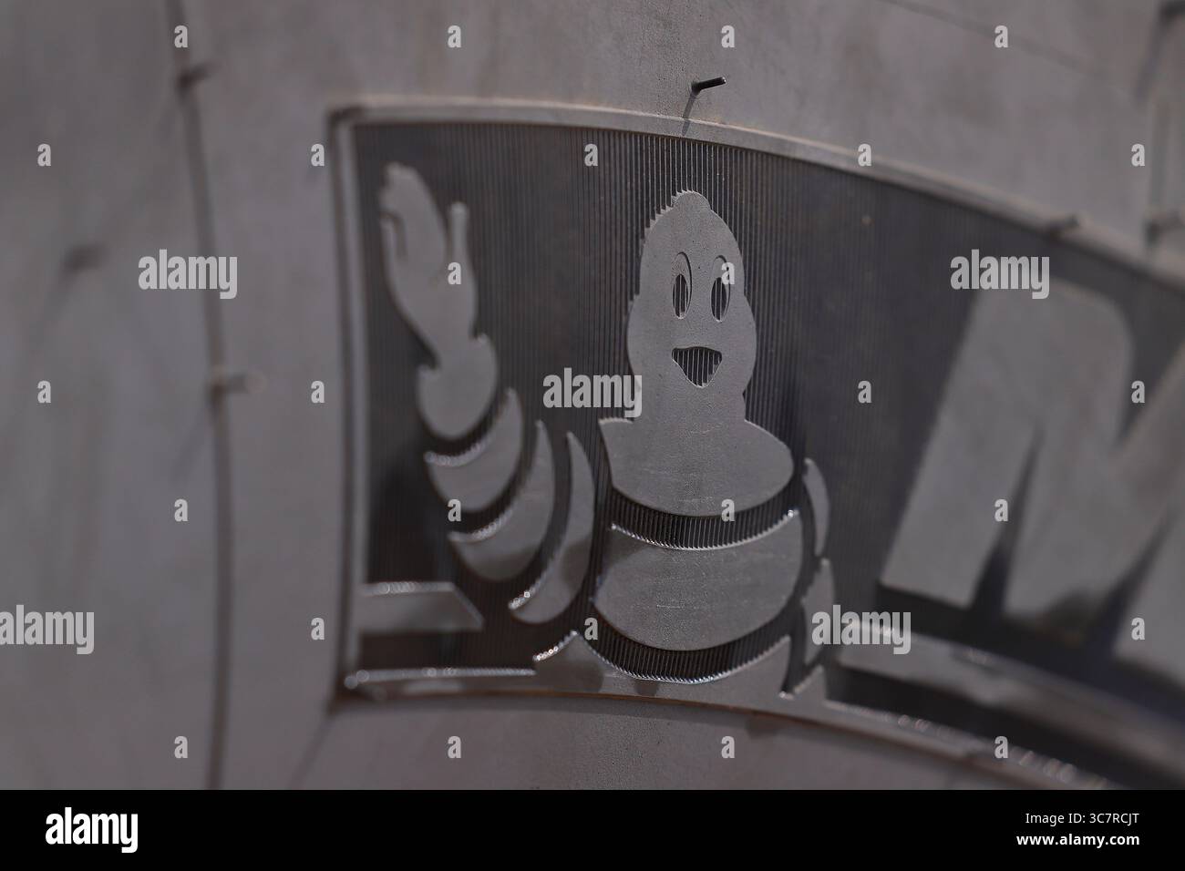 Close up of Michelin's Michelin Man logo on a telehandler tyre. tyre ...