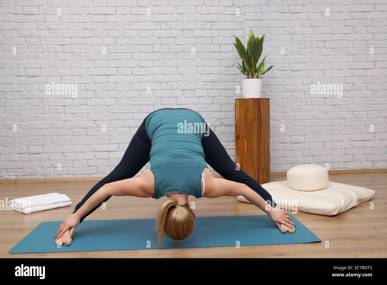 Wide stance forward bend hi-res stock photography and images - Alamy