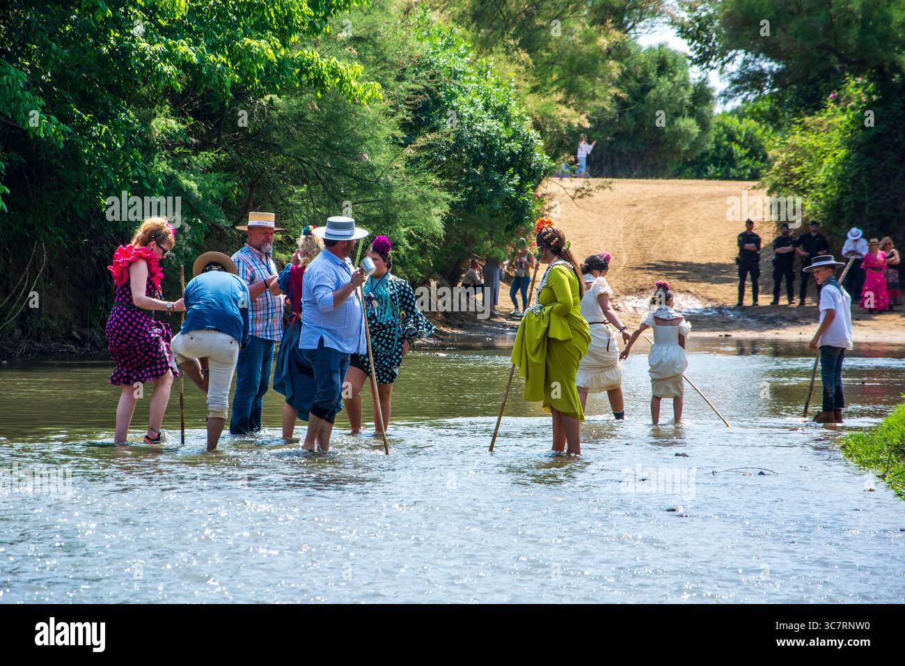 Almonte, Huelva, Spain. Pilgrims cross on foot the ford of the river ...