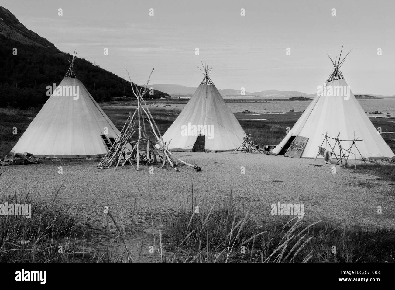 Traditional Sami tents near the sea in a remote northern Norwegian ...