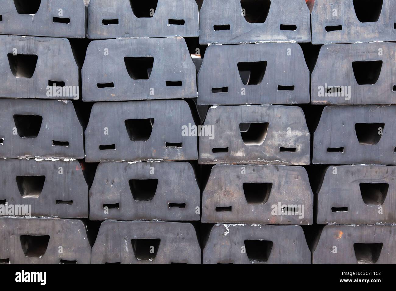 Black rubber blocks stacked next to each other Stock Photo - Alamy
