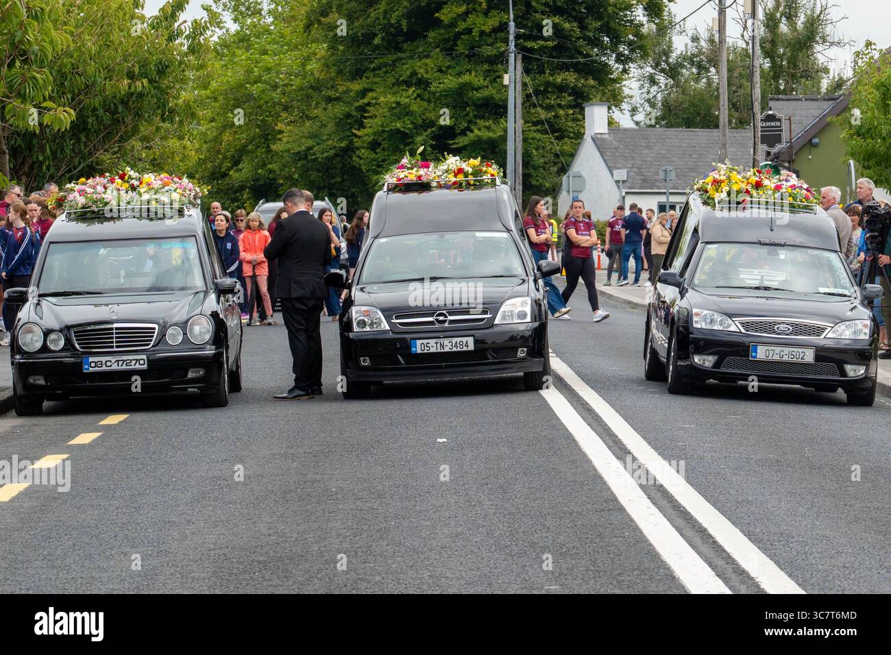 Three hearses carrying the coffins at the funeral for Vanessa Whyte and ...