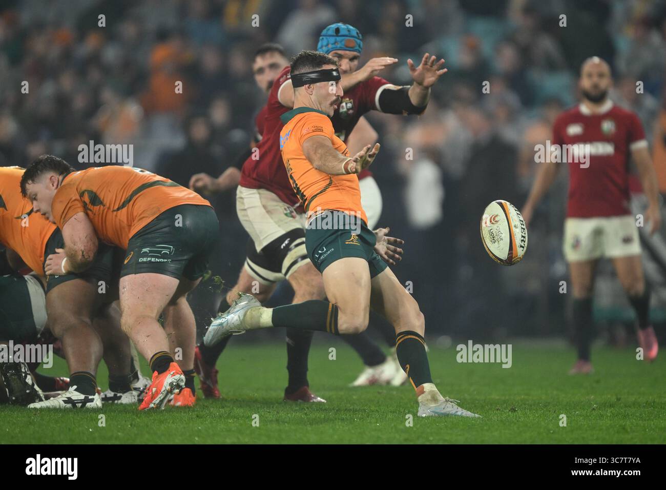 Nic White of Australia getsb an kick away during the Third Test match ...