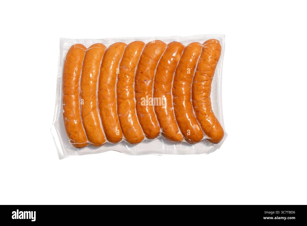Front view of eight evenly packaged sausages in vacuum film. The ...