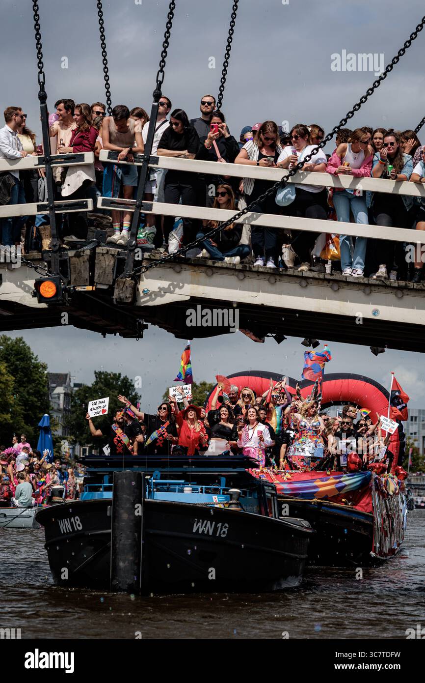 AMSTERDAM - Boats during the Canal Parade. The boat parade with eighty ...