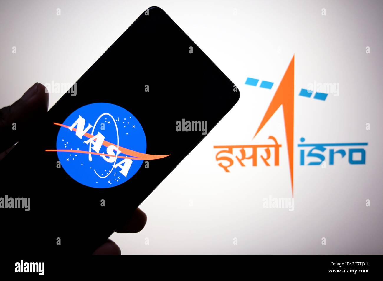 In this photo illustration, a NASA logo is seen displayed on a ...