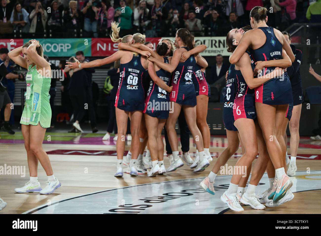 Melbourne Vixens players celebrate following the Super Netball Grand ...