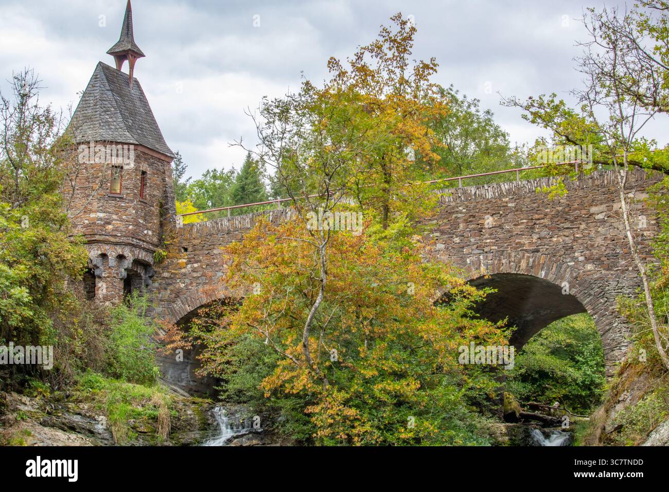 Morning after sunrise at a historic bridge with a waterfall. Landscape ...