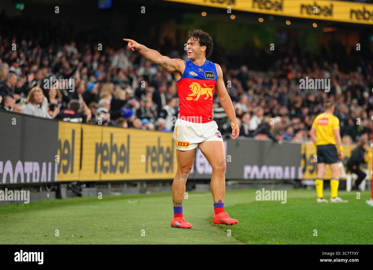 Cameron Rayner of the Lions celebrates after kicking a goal and reacts ...