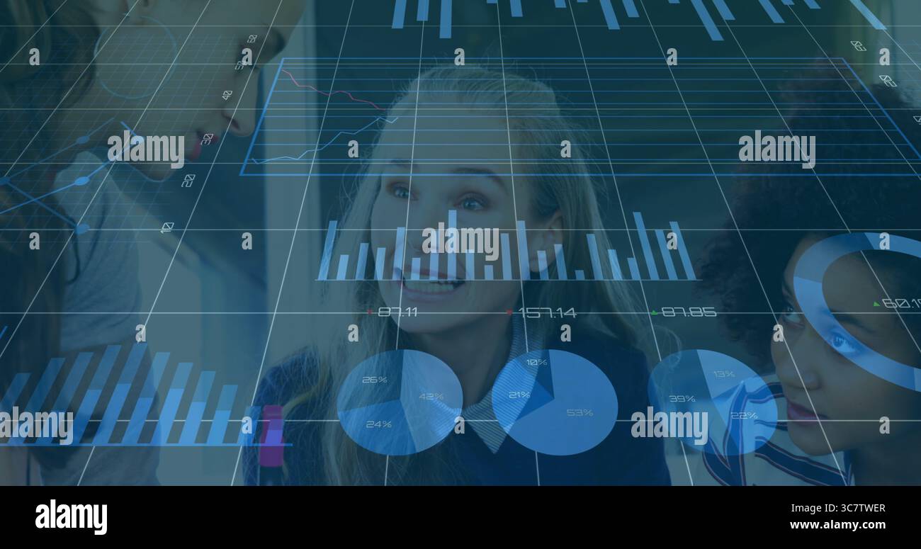 Data team in business attire leaning over table in office, analyzing ...
