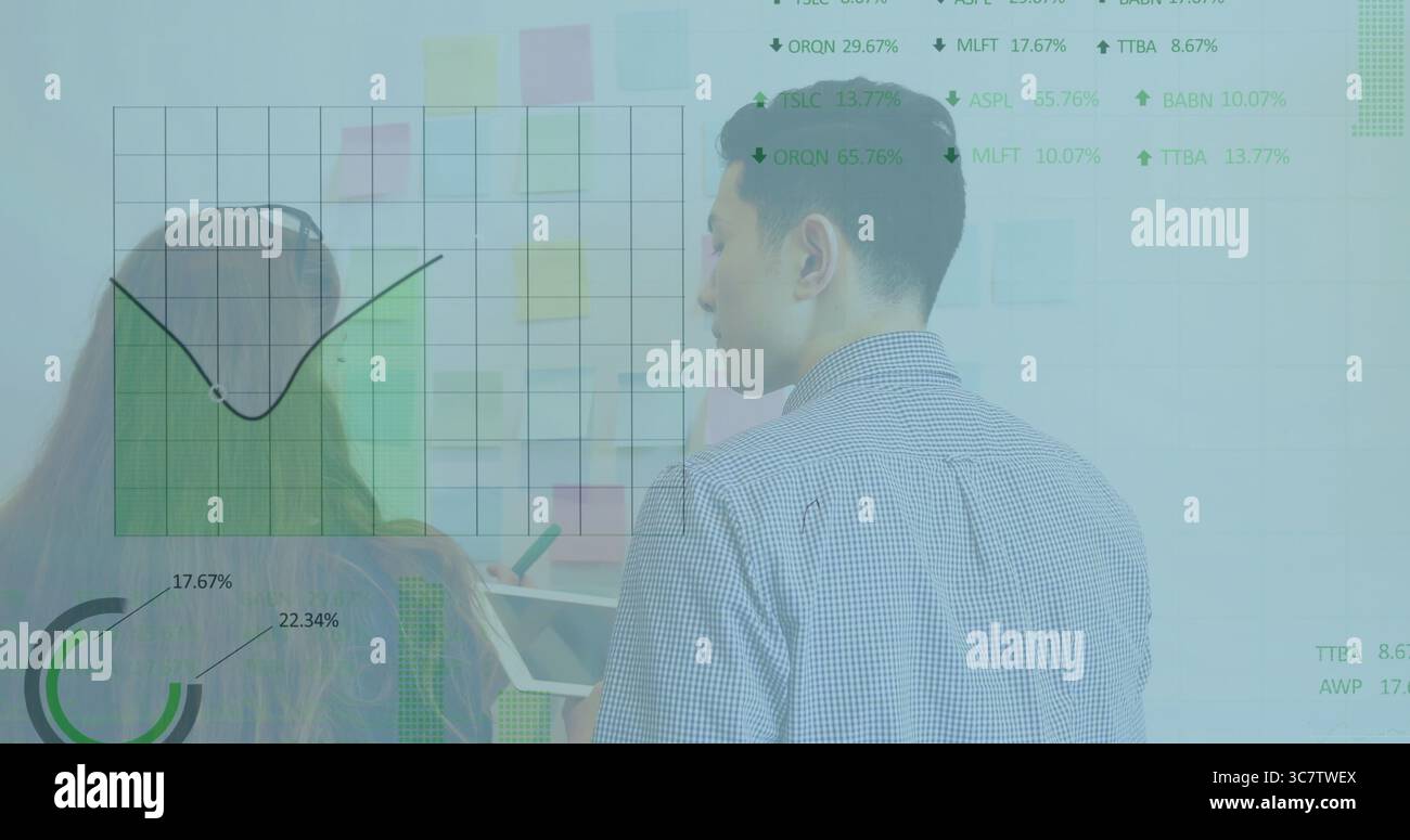 Analyzing business analysts reviewing hi-res stock photography and ...