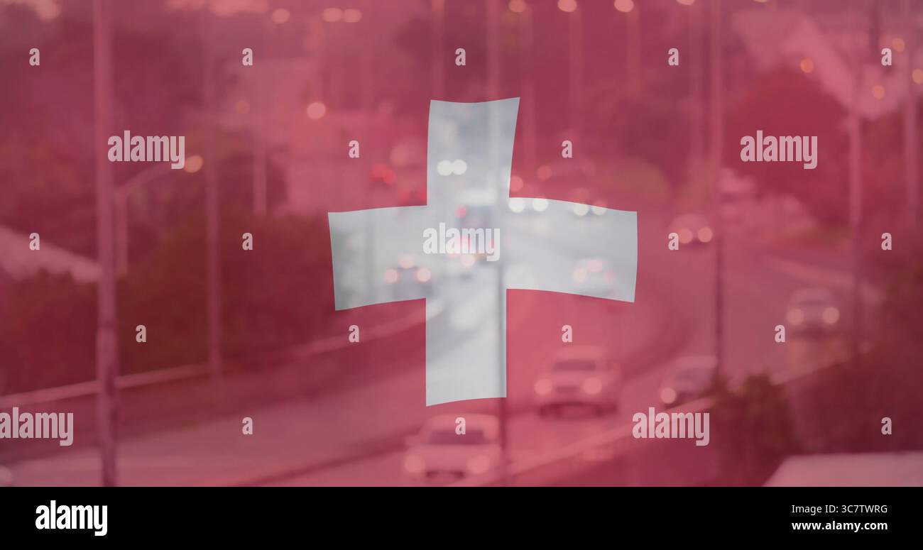 White Swiss cross symbol covering red-tinted dusk highway, with cars ...