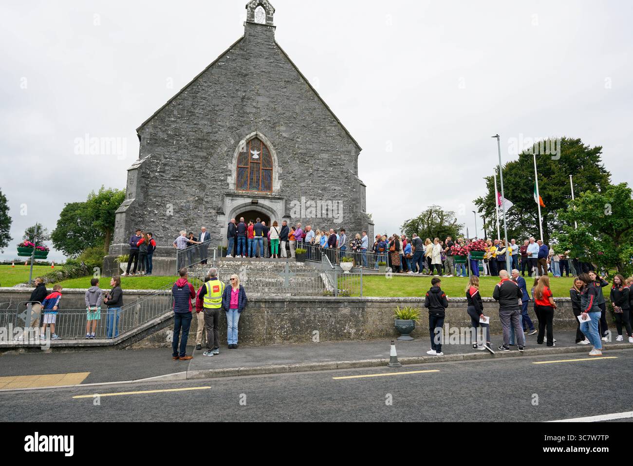 Mourners listen from outside the church at the funeral for Vanessa ...