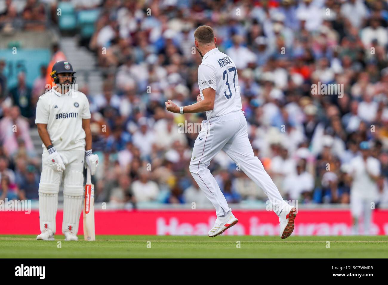 Gus Atkinson of England celebrates after the dismissal of Karun Nair of ...