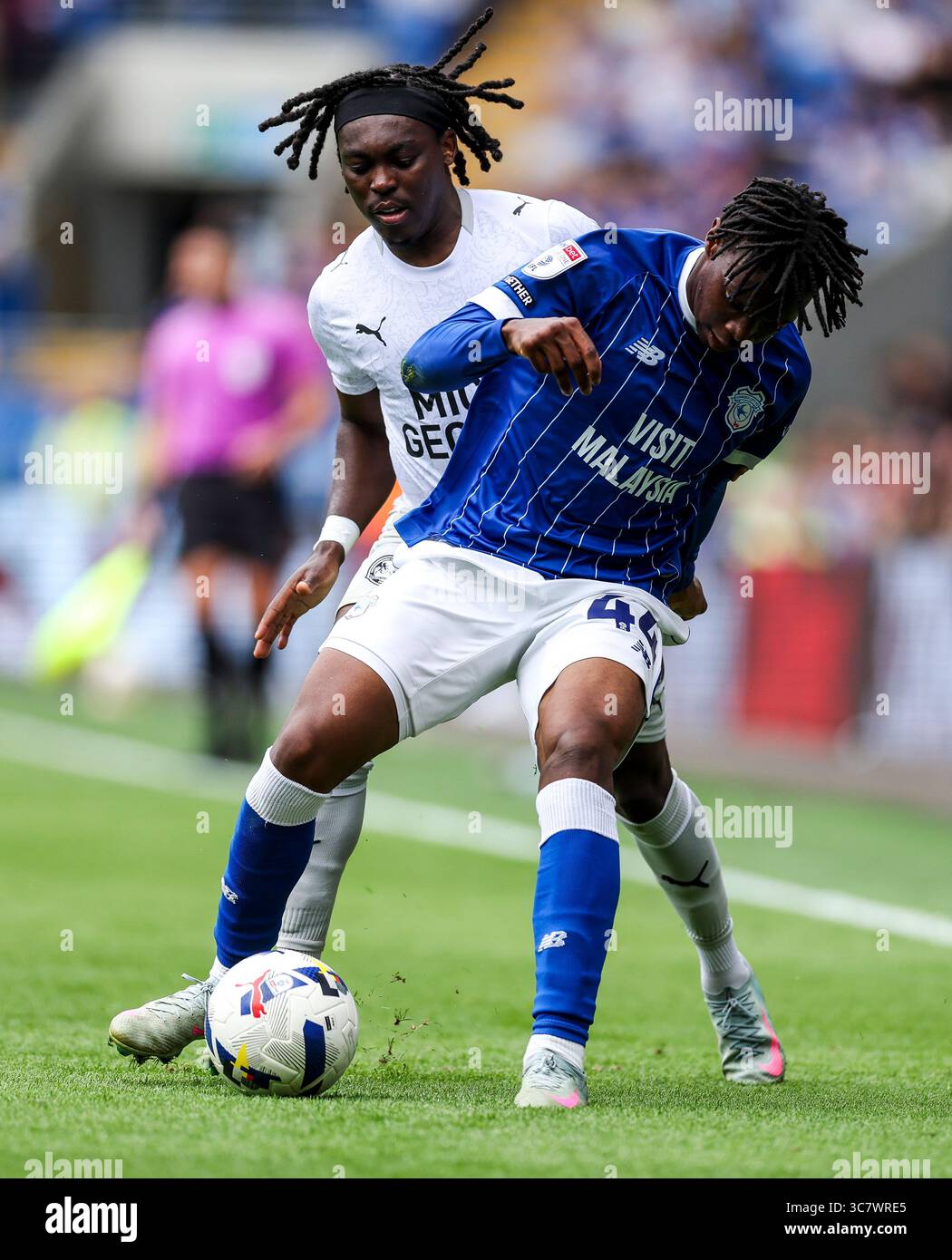 Cardiff City's Ronan Kpakio and Peterborough United's Abraham Odoh ...