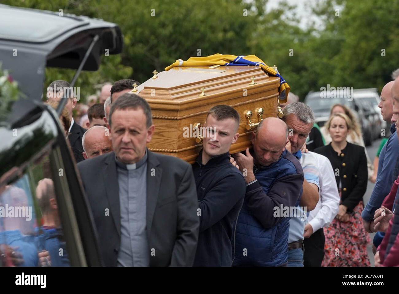 Pallbearers lift a coffin at the funeral for Vanessa Whyte and her ...