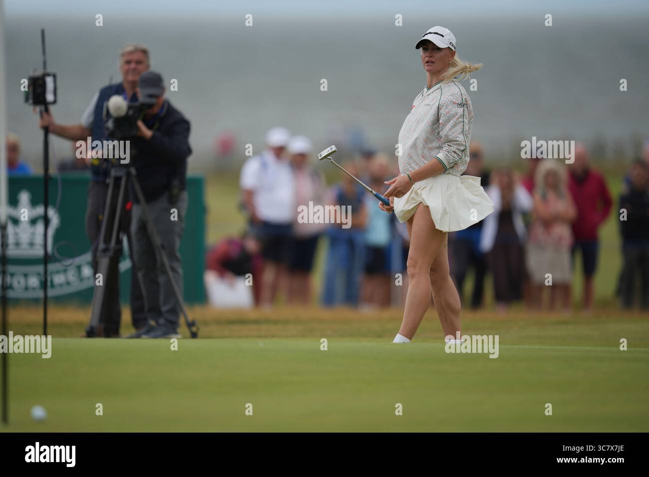 Charley Hull of England reacts after putting on the 17th green during ...