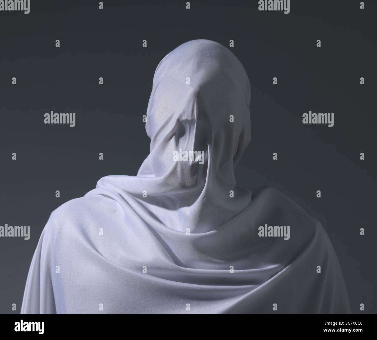 Creepy ghost. Man covered with white sheet on light grey background ...