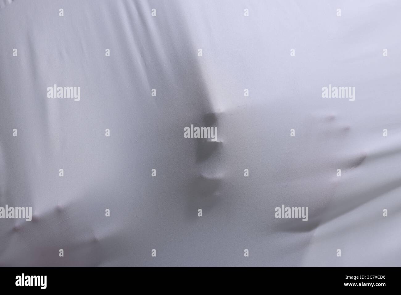 Silhouette of creepy ghost behind white sheet Stock Photo - Alamy