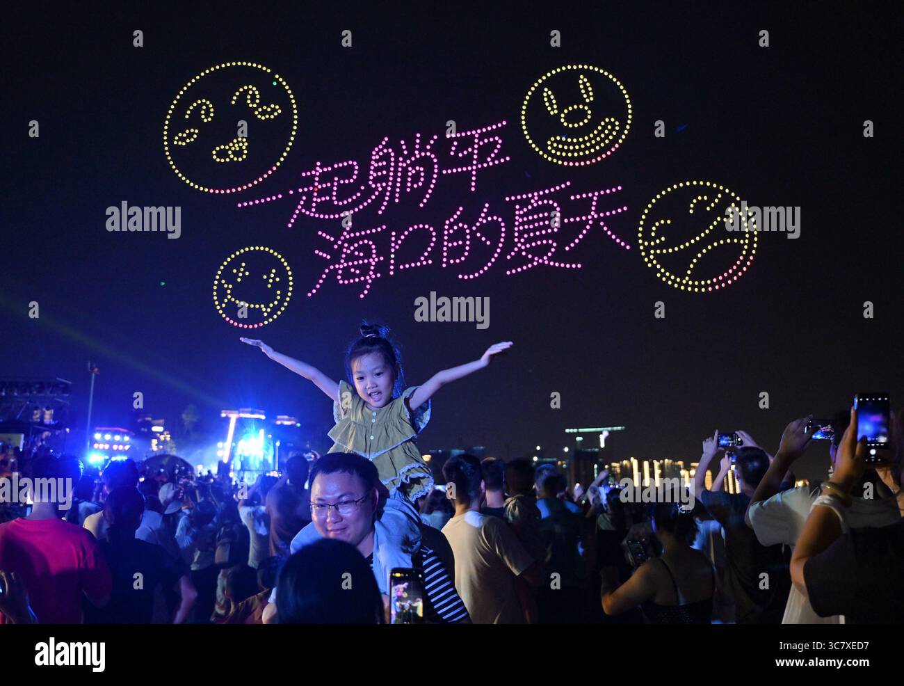 Haikou, China's Hainan Province. 2nd Aug, 2025. People watch a drone ...