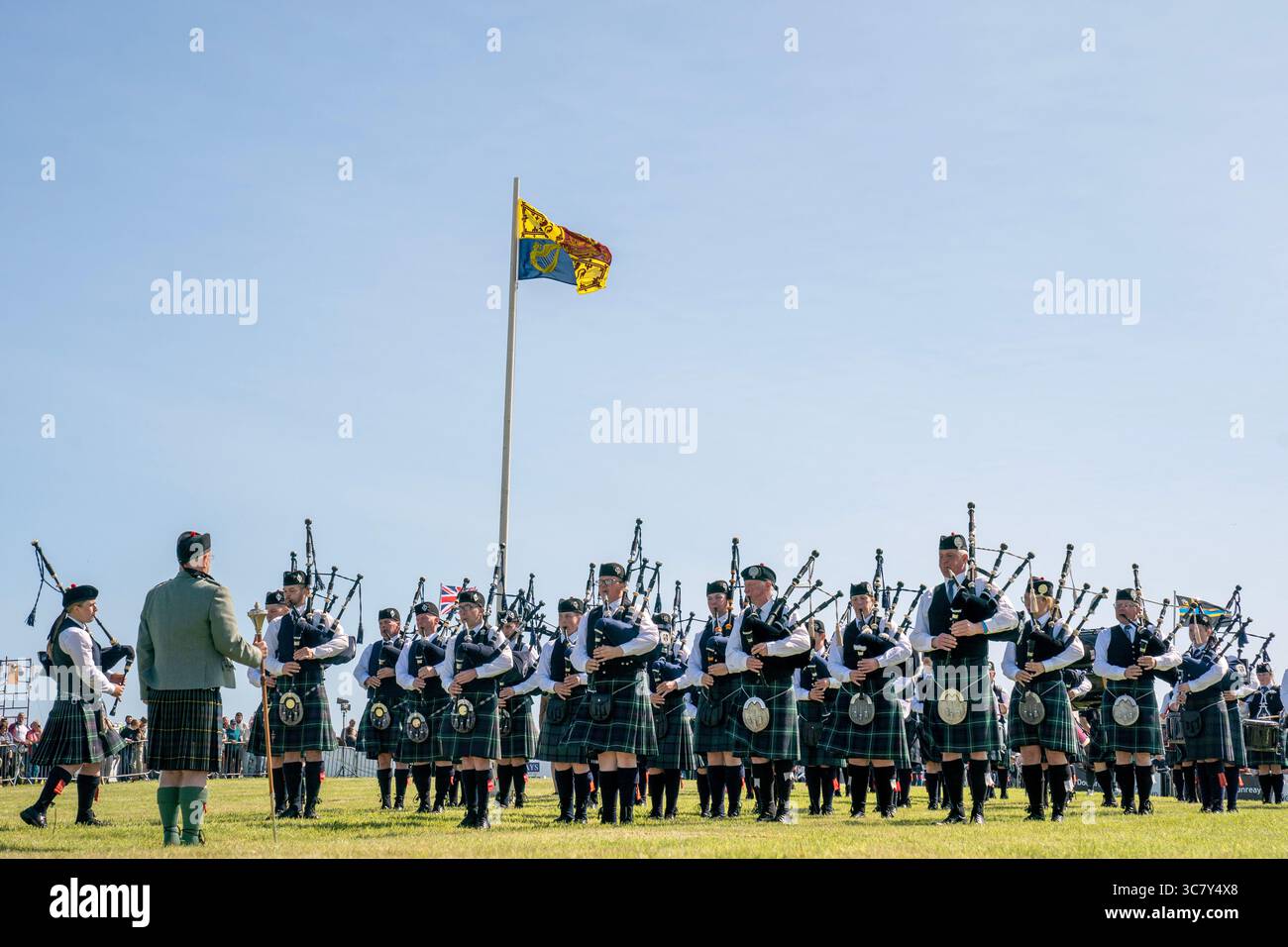 The Royal Standard flies above the pipe bands as King Charles III ...