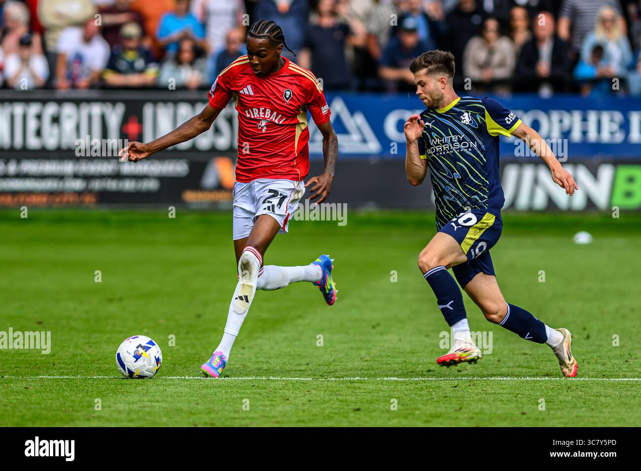 Kallum Cesay of Salford City FC under pressure from Calum Agius of ...