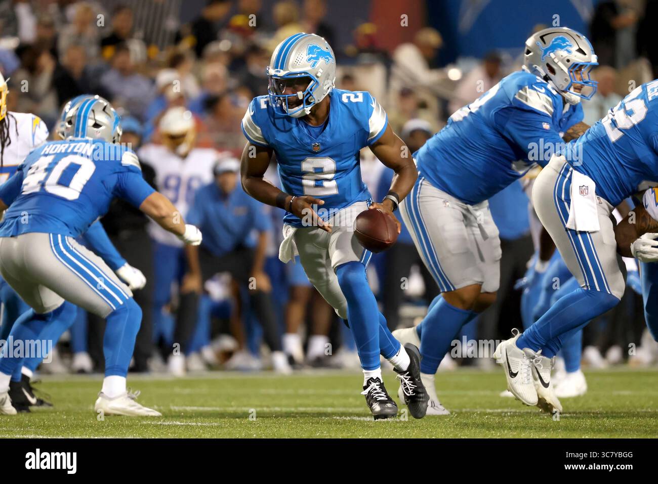Detroit Lions quarterback Hendon Hooker (2) drops back with the ball ...