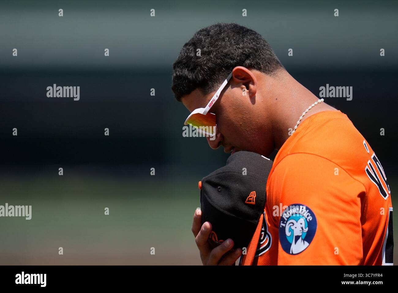 Baltimore Orioles' Luis Vázquez (52) stands for the Star-Spangled ...