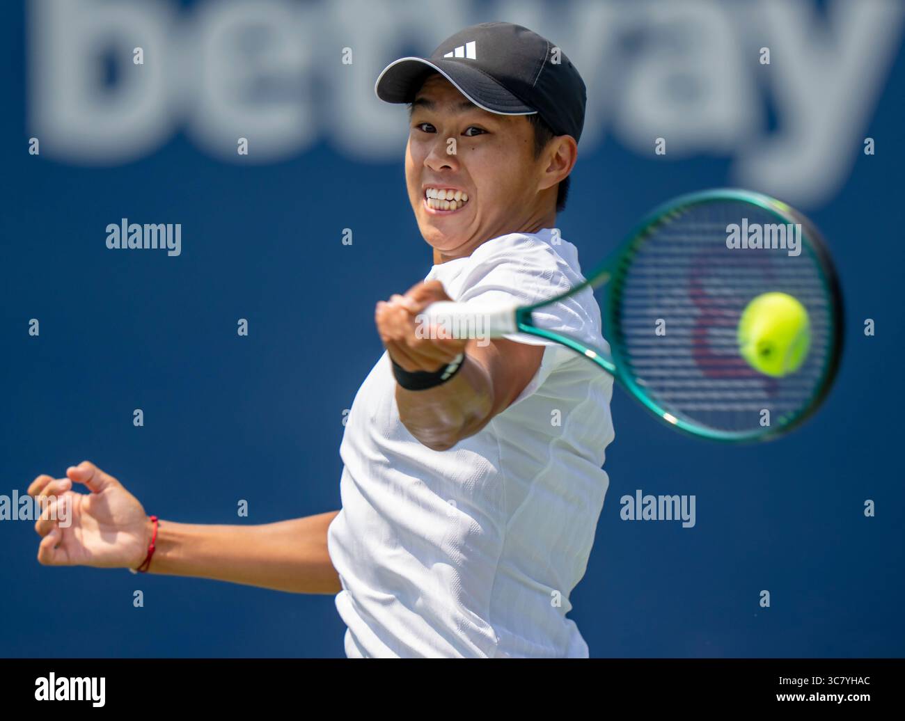 Learner Tien of the United States hits a forehand on his way to being ...
