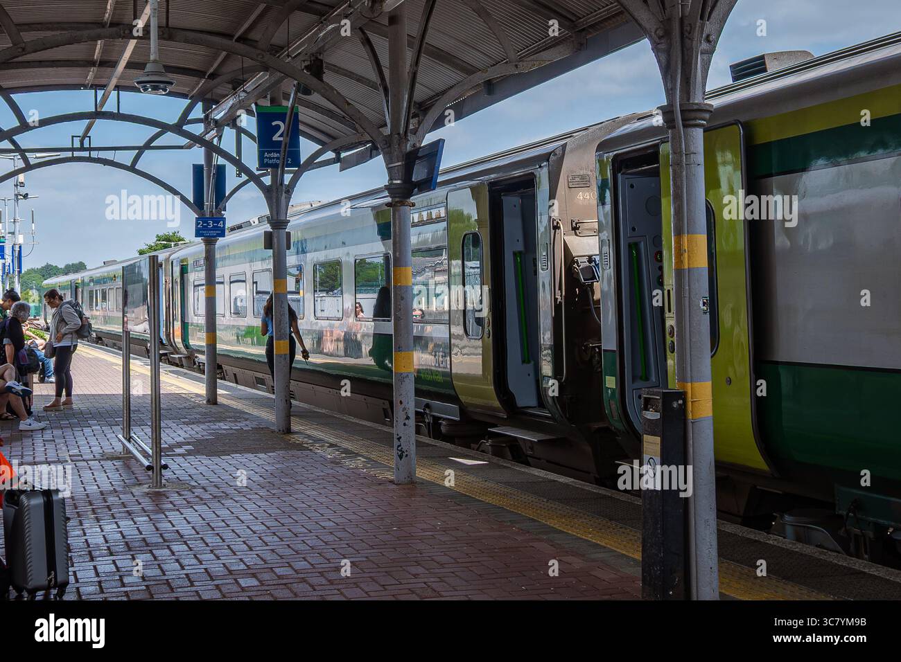 July 25, 2025 Cork, Ireland A modern train station showcasing green ...