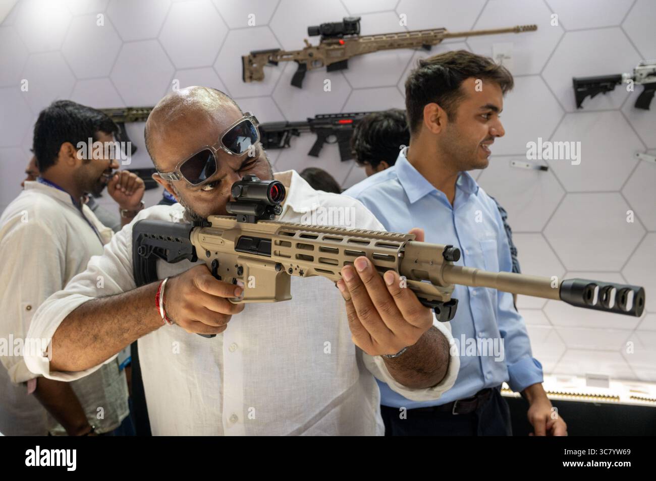 A man aims an M72 assault rifle manufactured by SSS Defence during the ...