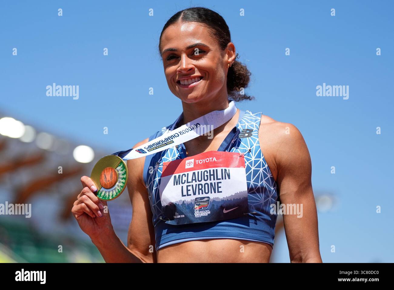 Sydney McLaughlin-Levrone shows her gold medal after winning the women ...