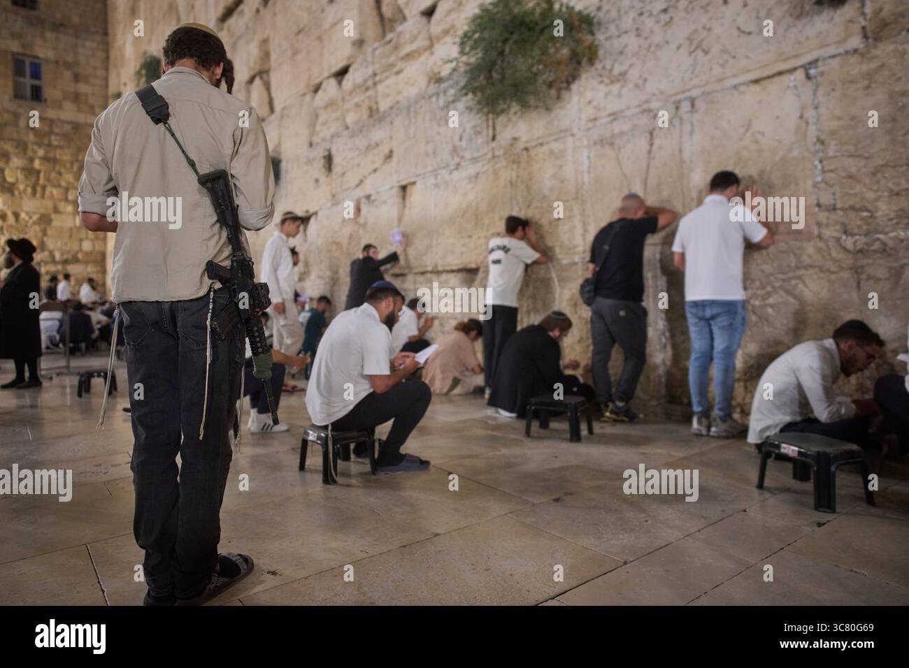 Ultra-orthodox Jewish men pray during the mourning ritual of Tisha B'Av ...