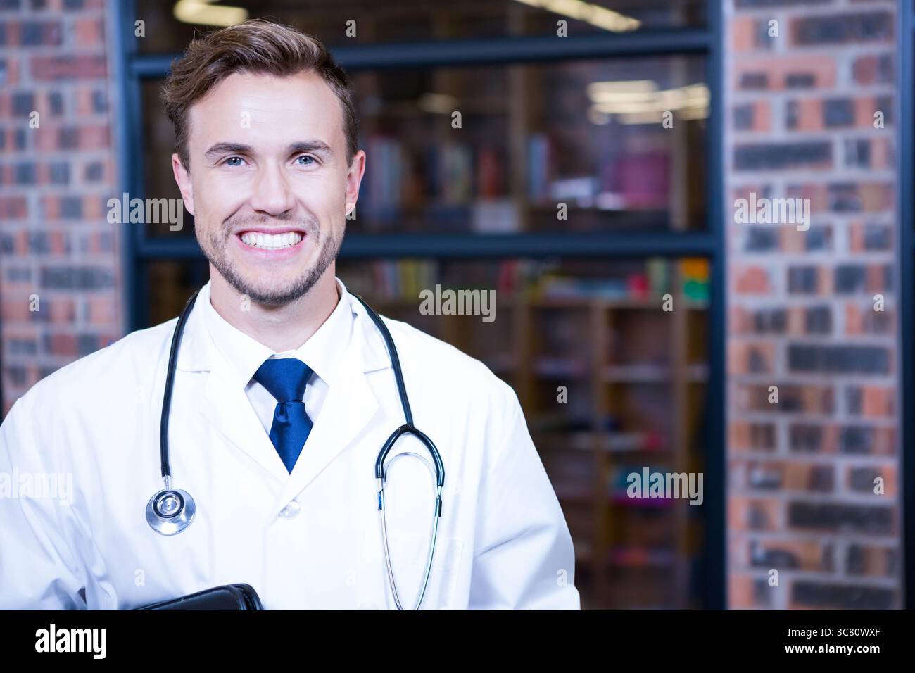 Doctor standing outside clinic wearing lab coat and tie, holding ...