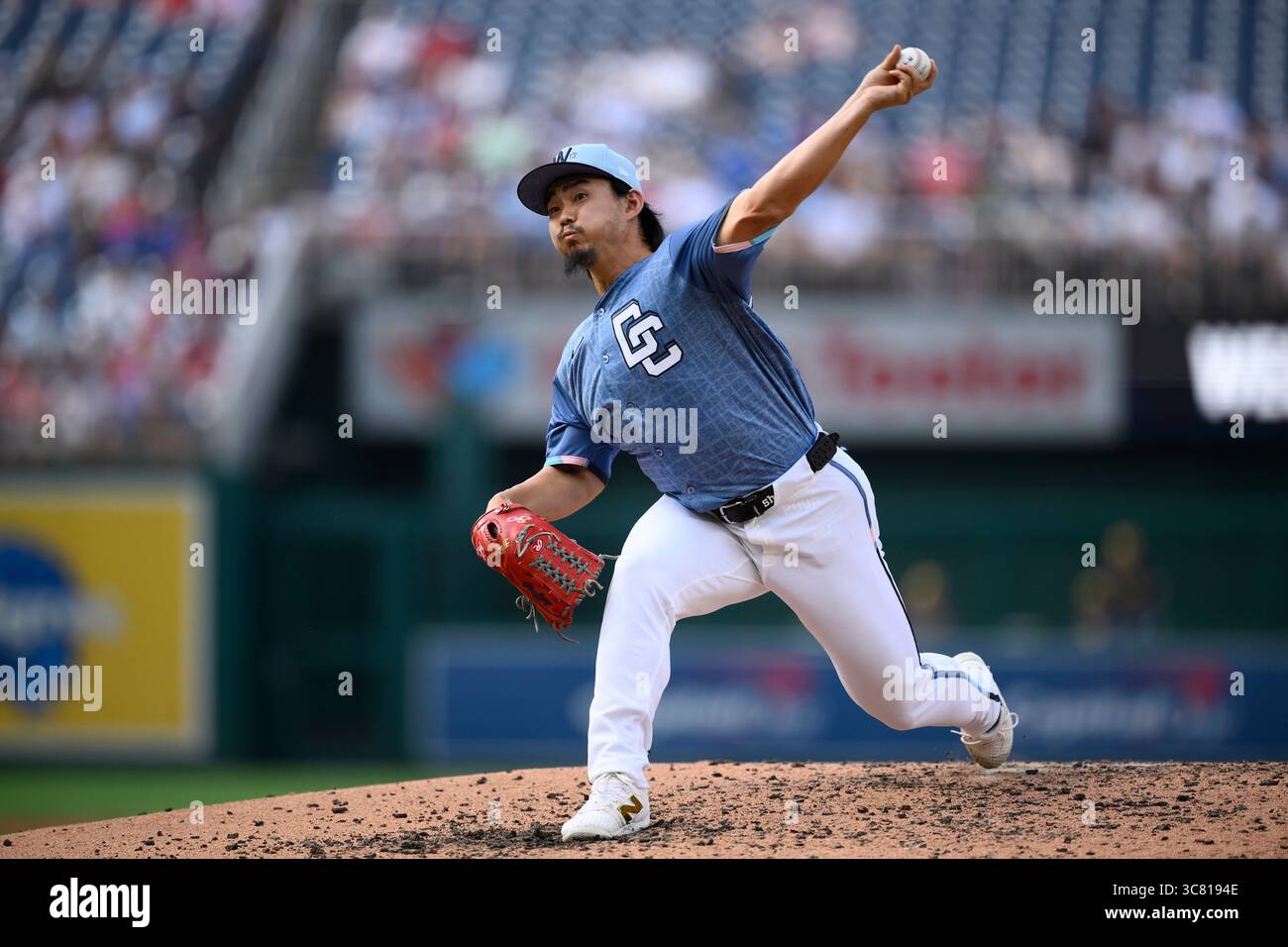 Washington Nationals relief pitcher Shinnosuke Ogasawara throws during ...