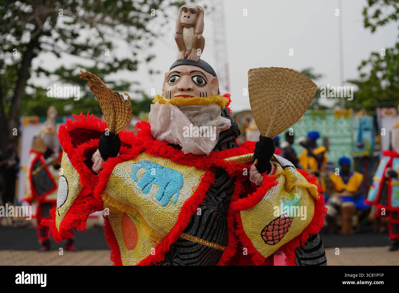A man dressed in a costume dances during the mask festival in Porto ...