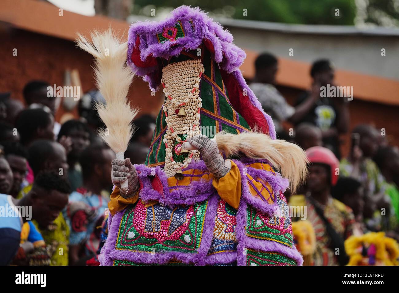 A man dressed in a costume performs during the mask festival in Porto ...