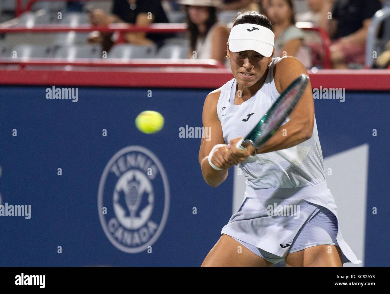 Jessica Bouzas Maneiro, of Spain, hits a return to Lin Zhu, of China ...