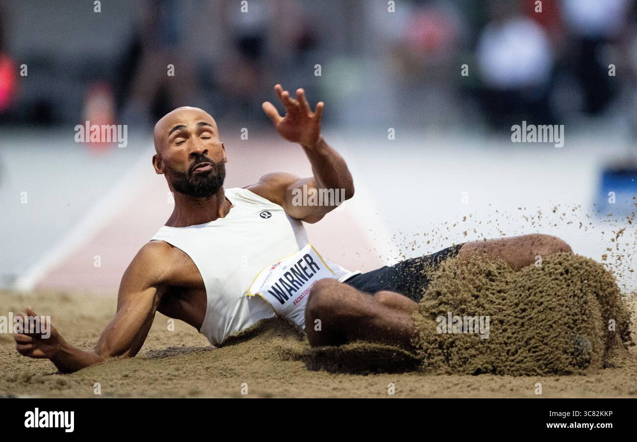 Damian Warner lands in the sand pit during the Men Long Jump Senior ...