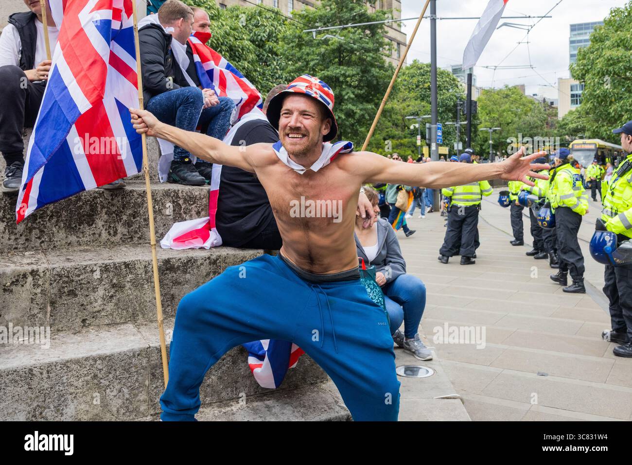 Manchester, UK. 02 AUG, 2025. Man poses for photographs as Britain ...