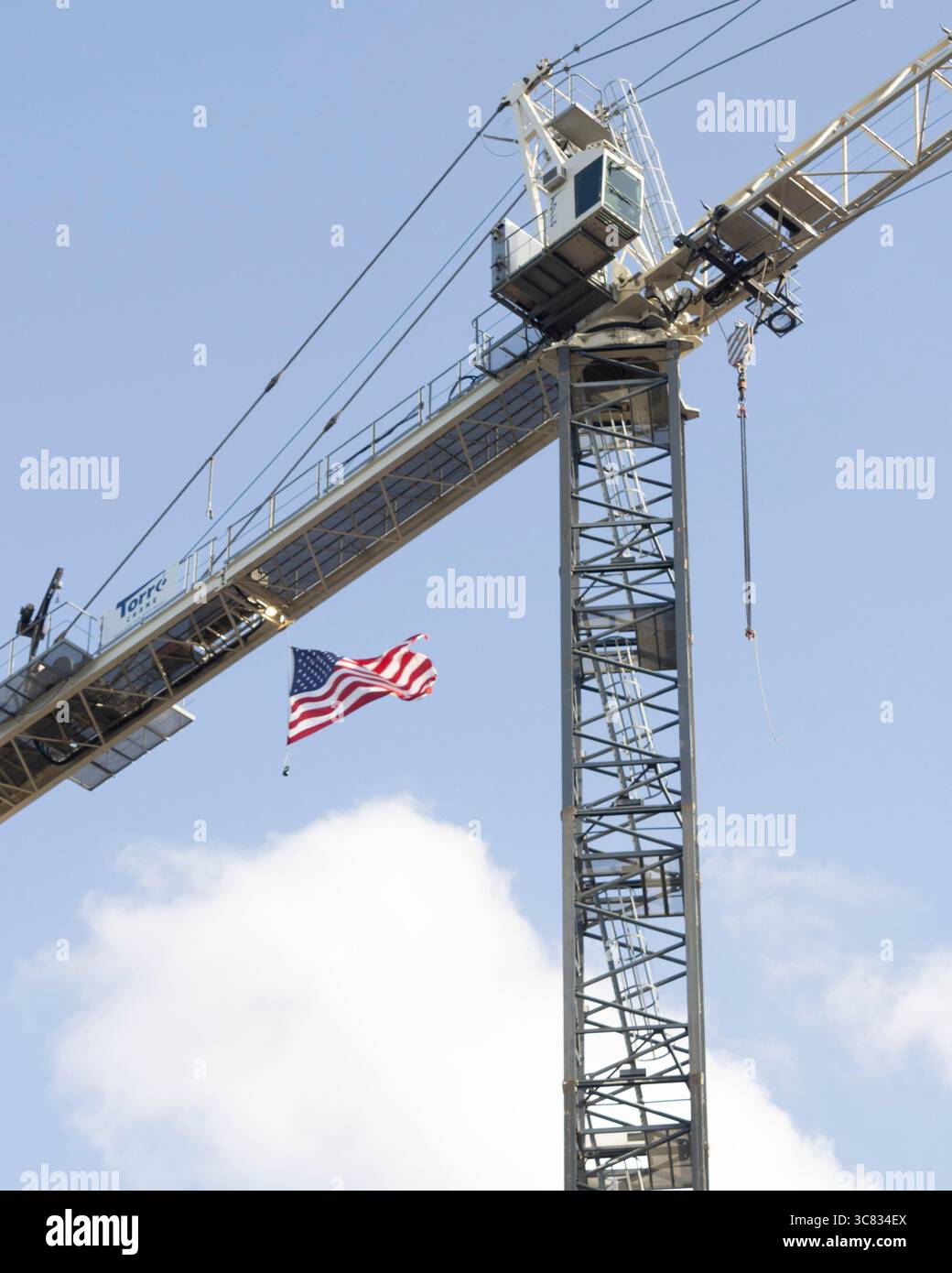 Construction Crane with American Flag Stock Photo - Alamy