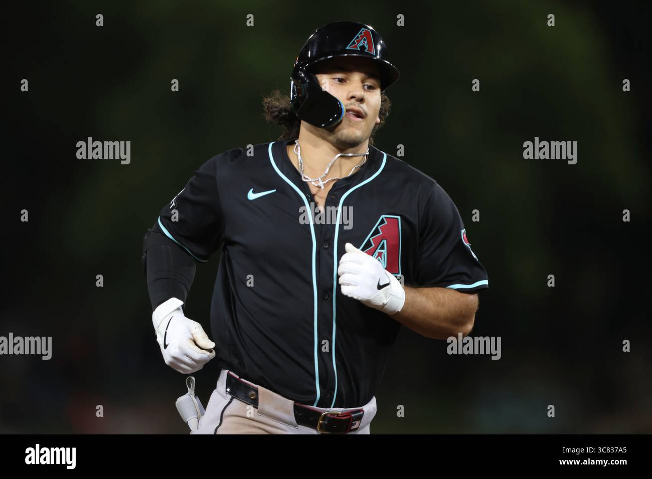 Arizona Diamondbacks' Alek Thomas jogs around the bases as after ...