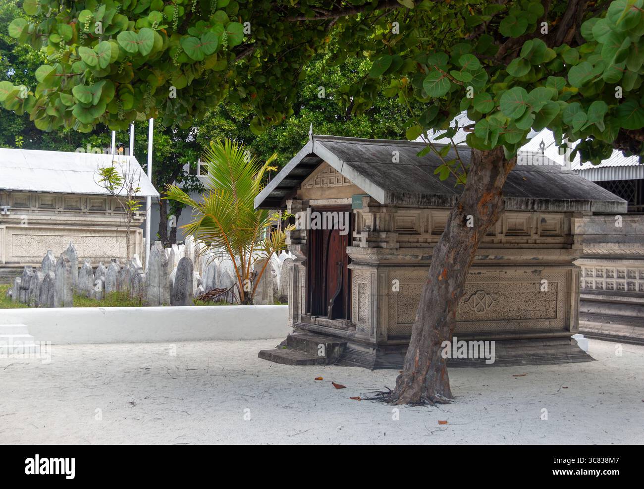 Historic stone structures and ancient graves under a green tree Stock ...