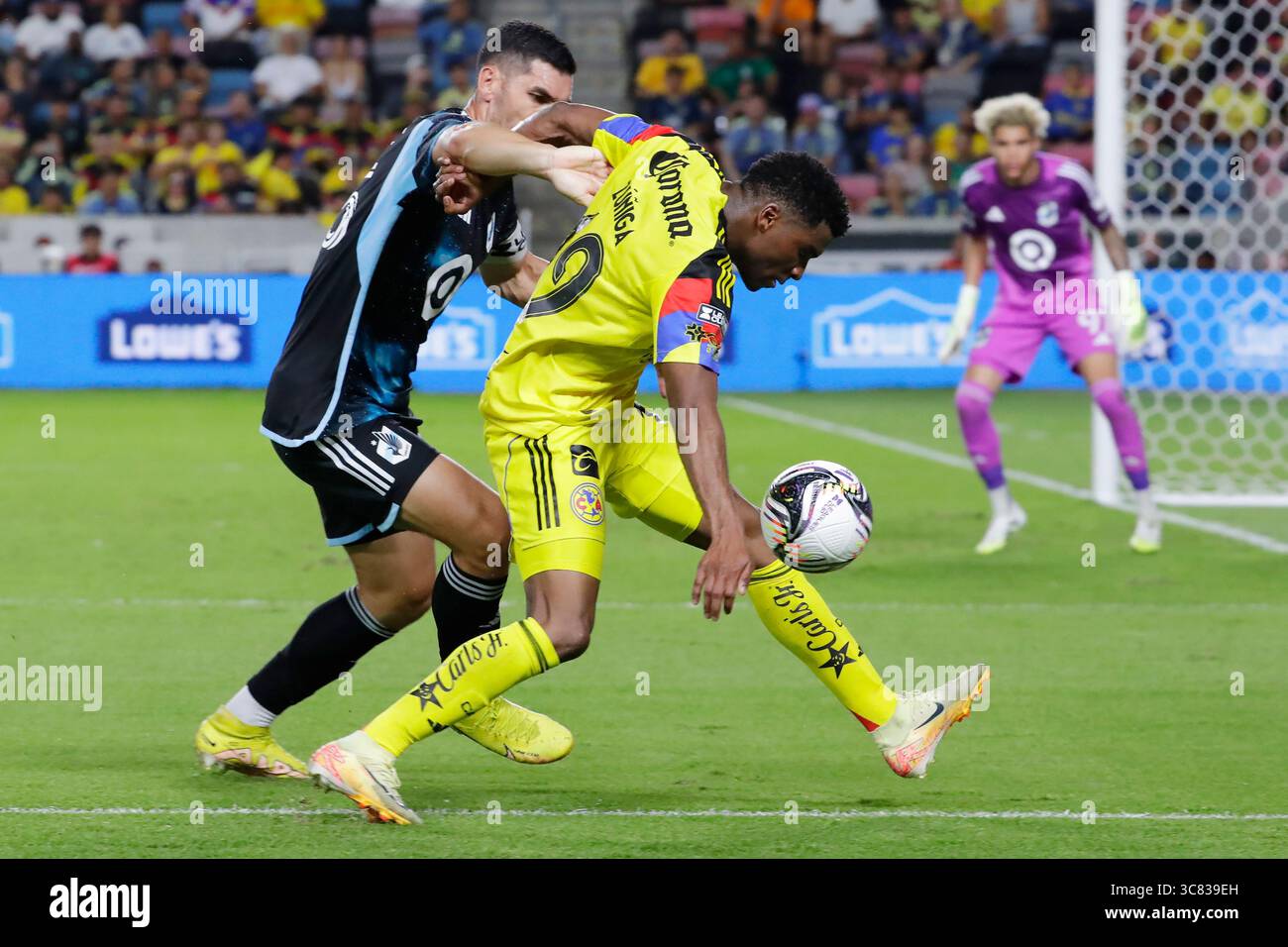 Minnesota United defender Michael Boxall, left, grabs at Club America defender Jose Zuniga ...
