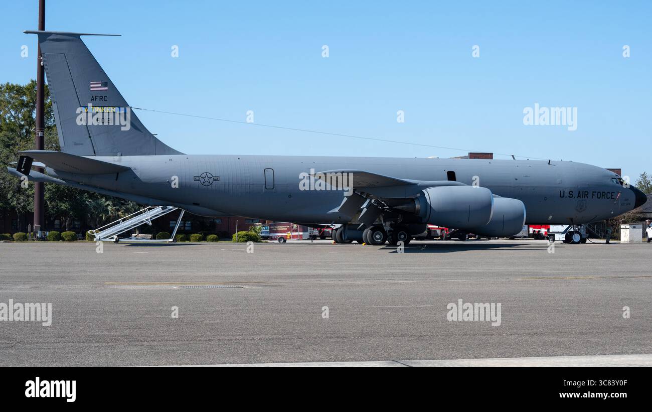 A U.S. Air Force KC-135 Stratotanker parked on an airfield under a ...