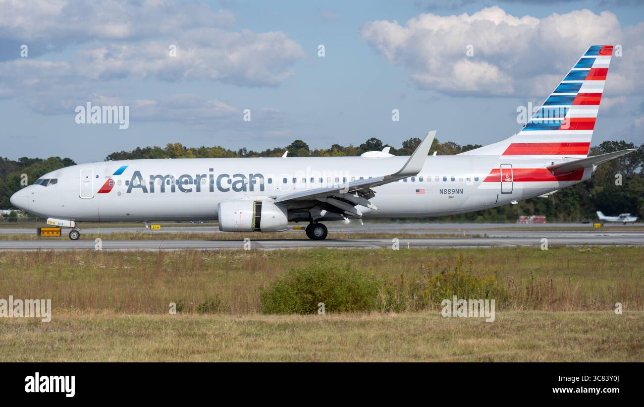 American Airlines Boeing 737 plane taxiing on runway with clear sky ...