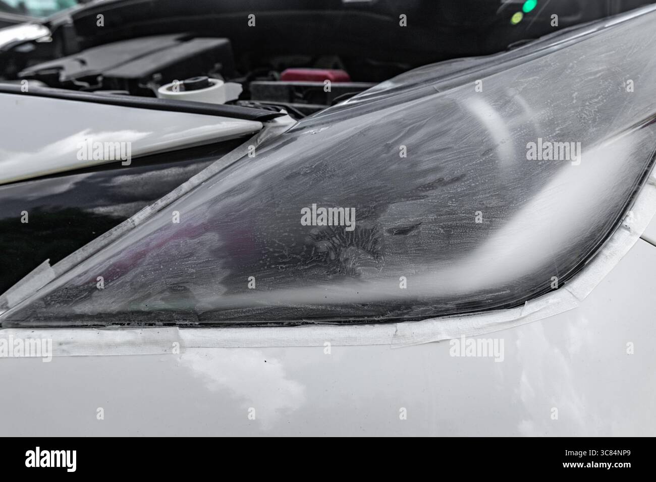 Polishing damaged car headlights with sandpaper, car lamp renovation ...