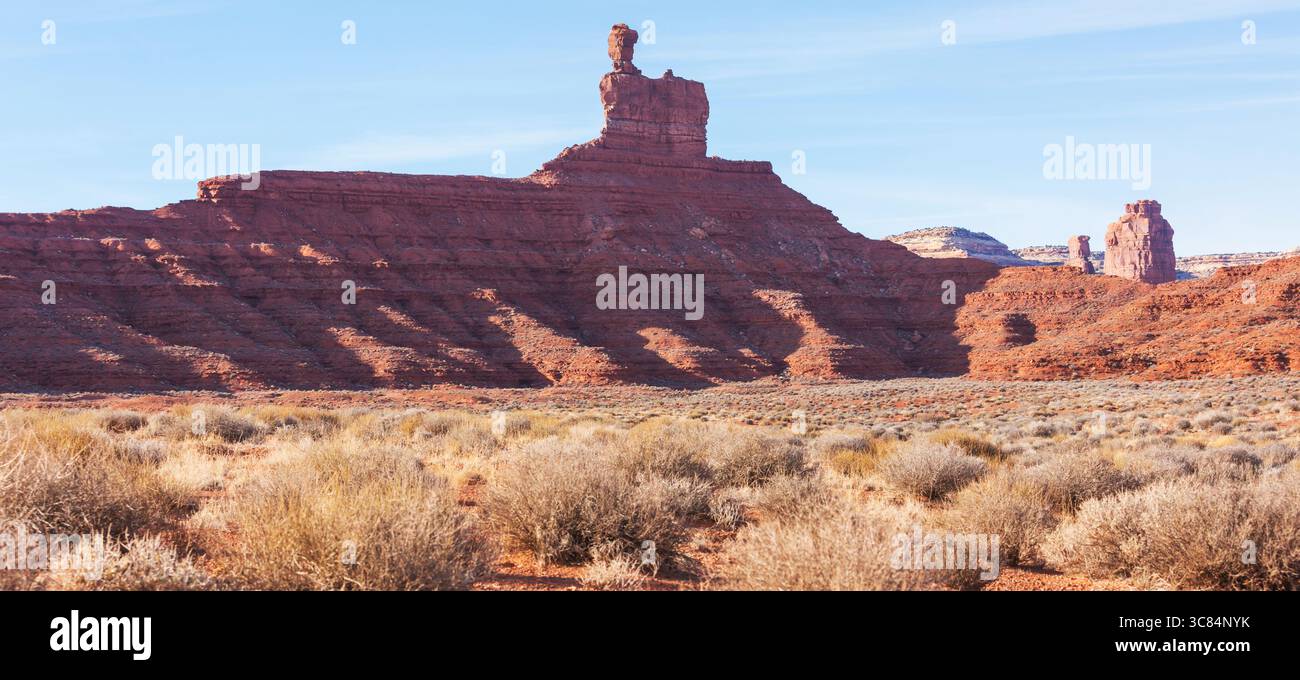 Valley of the Gods rock formation with Monument Valley at sunrise Stock ...